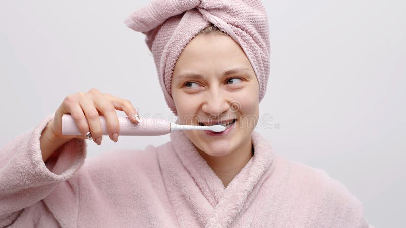 Girl Holding An Electric Toothbrush Brushing Her Teeth Personal Hygiene