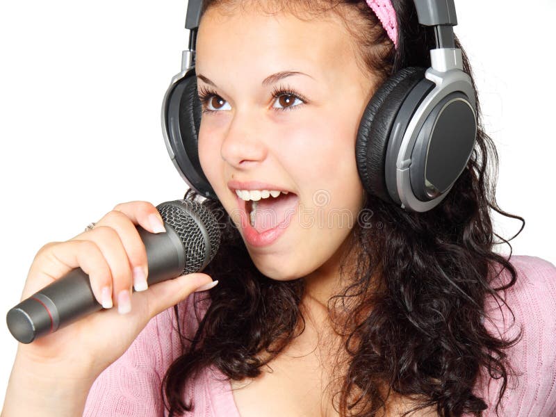 A Girl Holding A Microphone With A Headphone Picture. Image: 83036399