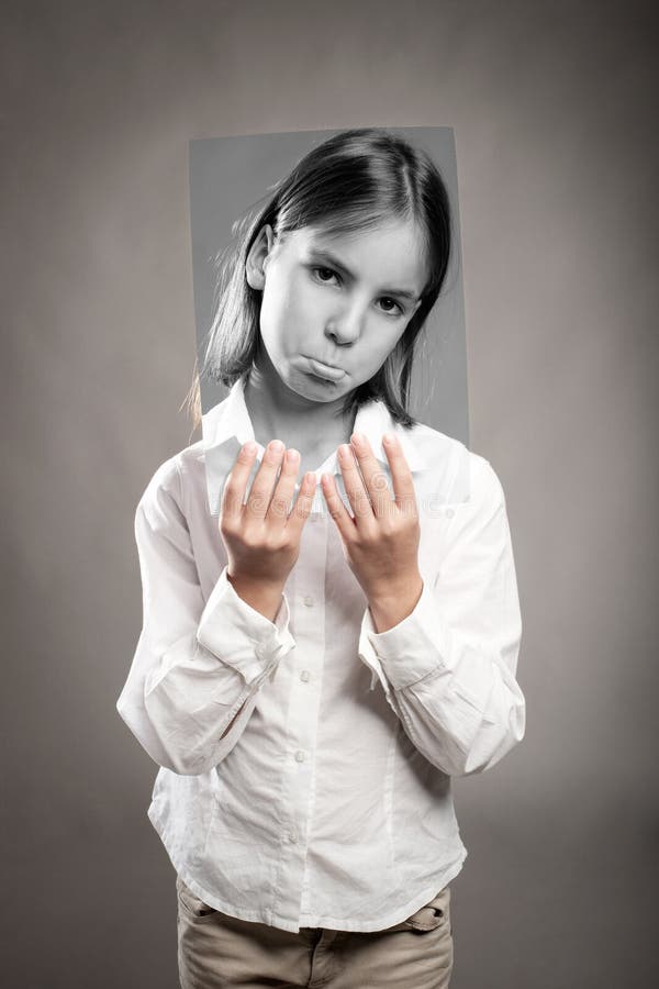 Girl Holding a Photography with Sad Expression Stock Photo - Image of ...
