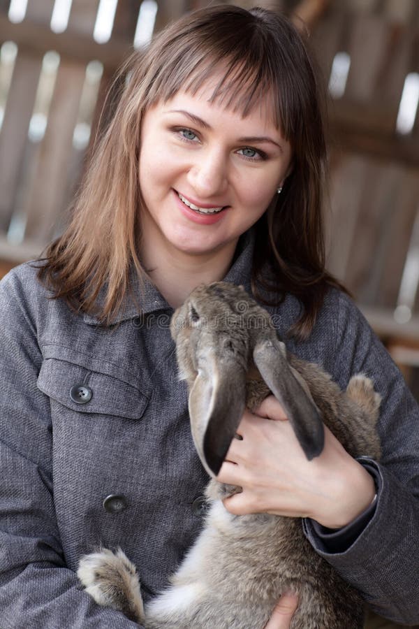 Girl holding rabbit stock photo. Image of cheerful, elegance - 33297662
