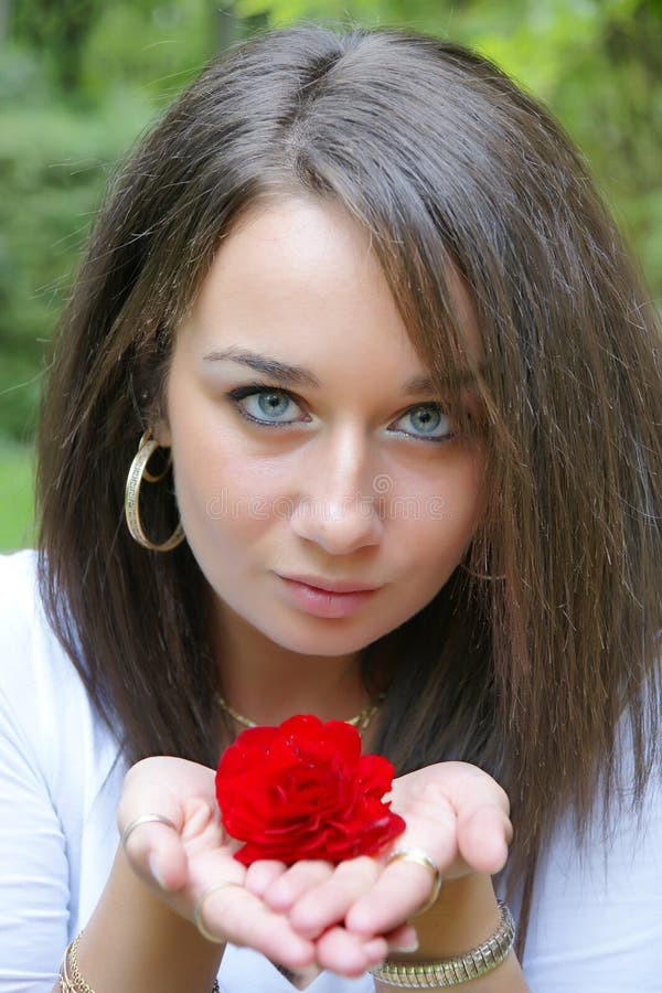 Girl holding a red rose stock image. Image of beauty - 11685043