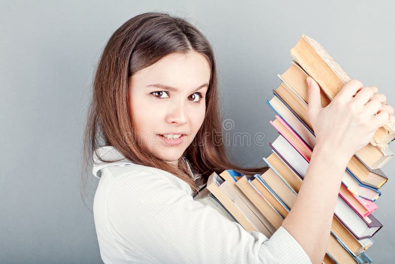 Girl holding stack of book stock photo. Image of holding - 40527210