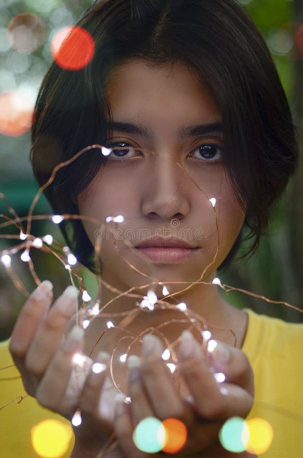 Girl Holding String Lights Picture. Image: 114677769