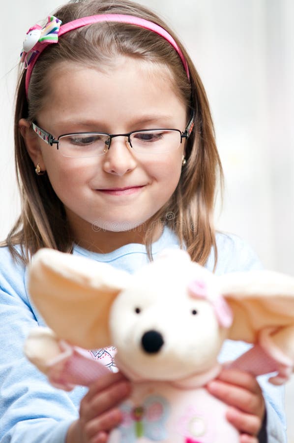 Girl Holding Stuffed Animal Stock Photo - Image of white, smiling: 14218378