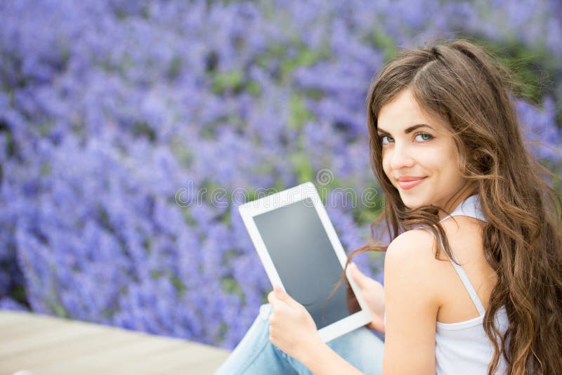Girl Holding Tablet Computer and Smiling Stock Photo - Image of ...