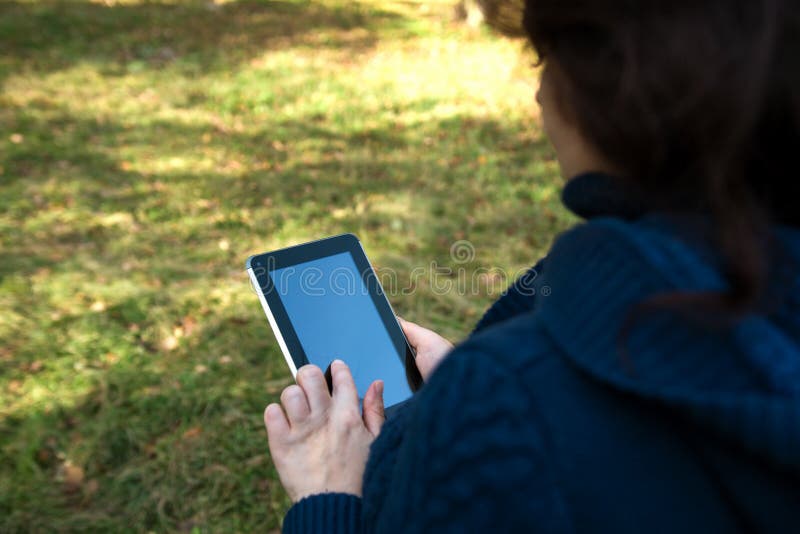 Girl Holding a Tablet in Hands Stock Image - Image of summer, person ...