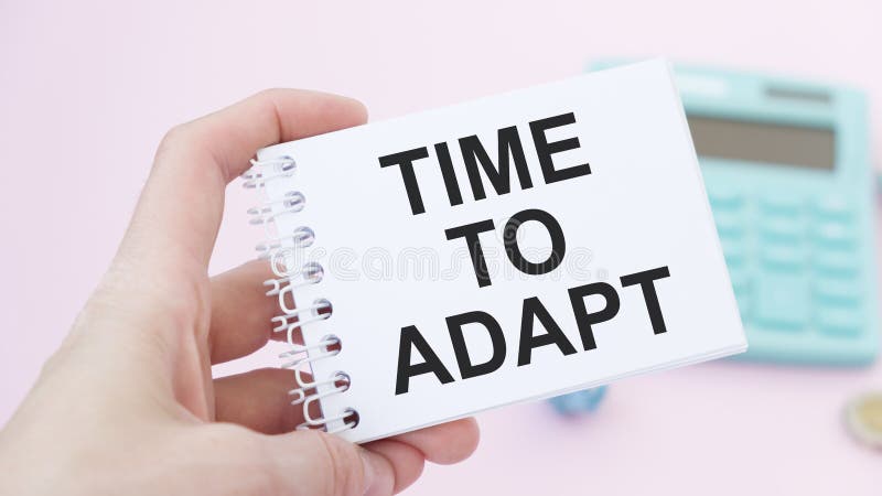 Girl Holds a Card with the Text TIME TO ADAPT Stock Image - Image of ...
