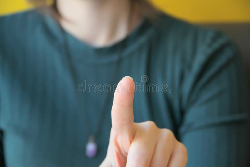 Girl Holds Index Finger in Front of Her, Points Towards the Viewer and ...