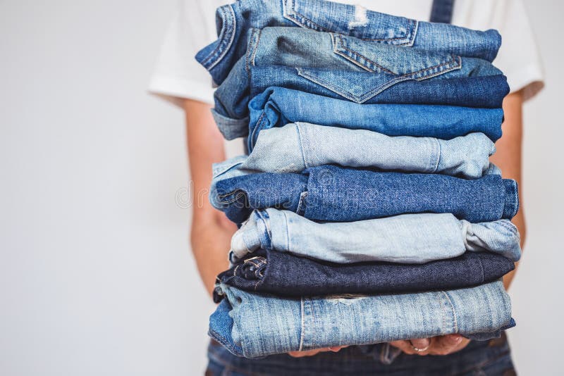 Jeans in her hands stock photo. Image of jeans, color - 131851790