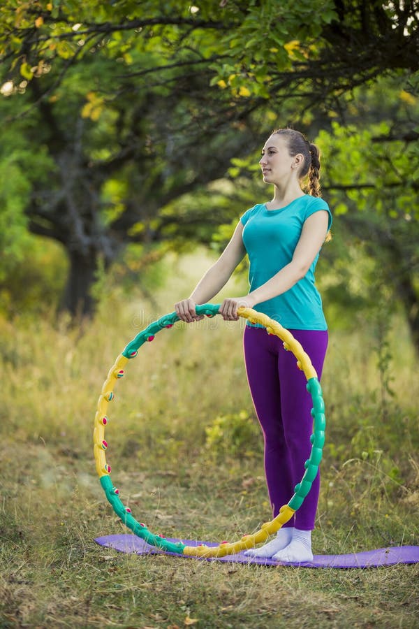 Girl with hoop stock photo. Image of happy, exercise - 65992178