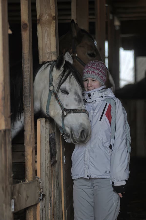 Girl with a horse stabled stock photo. Image of girls - 44873208
