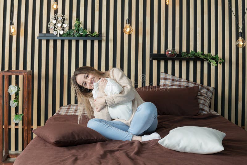 Girl hugging a pillow stock image. Image of studio, fashion - 141185247