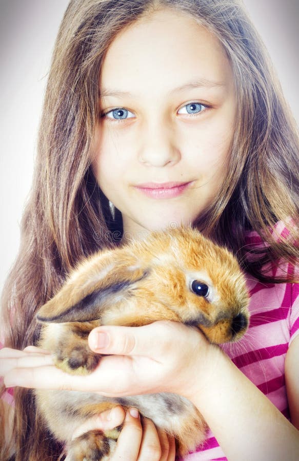 Girl hugging rabbit stock photo. Image of embracing, girl - 72017618