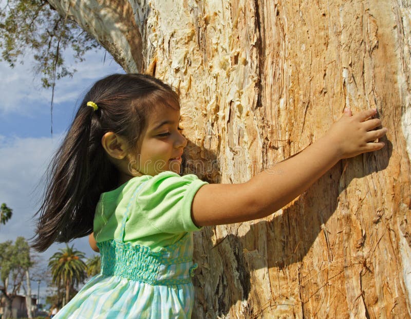 Girl Hugging a Tree stock image. Image of happiness, candid - 4057797