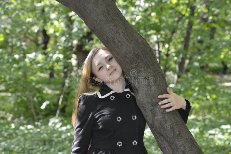 A girl hugging a tree stock photo. Image of face, natural - 41100116