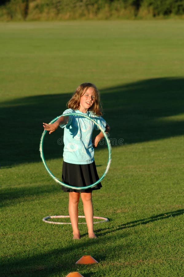 Girl with hula-hoop stock photo. Image of hoop, park, game - 4921012