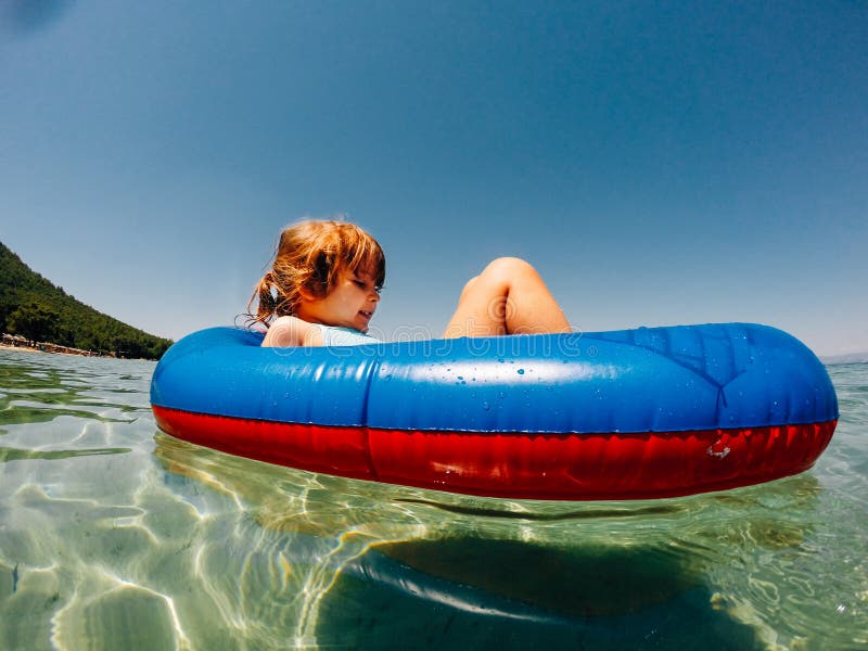 Girl in inflatable raft stock photo. Image of inflatable - 62906688