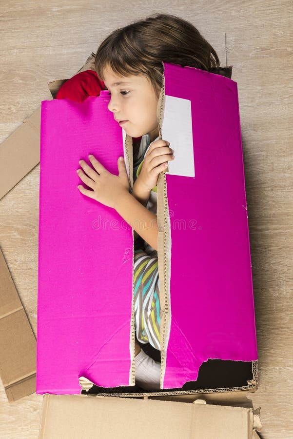Girl Inside a Cardboard Box Stock Image - Image of pajama, pink: 60898953