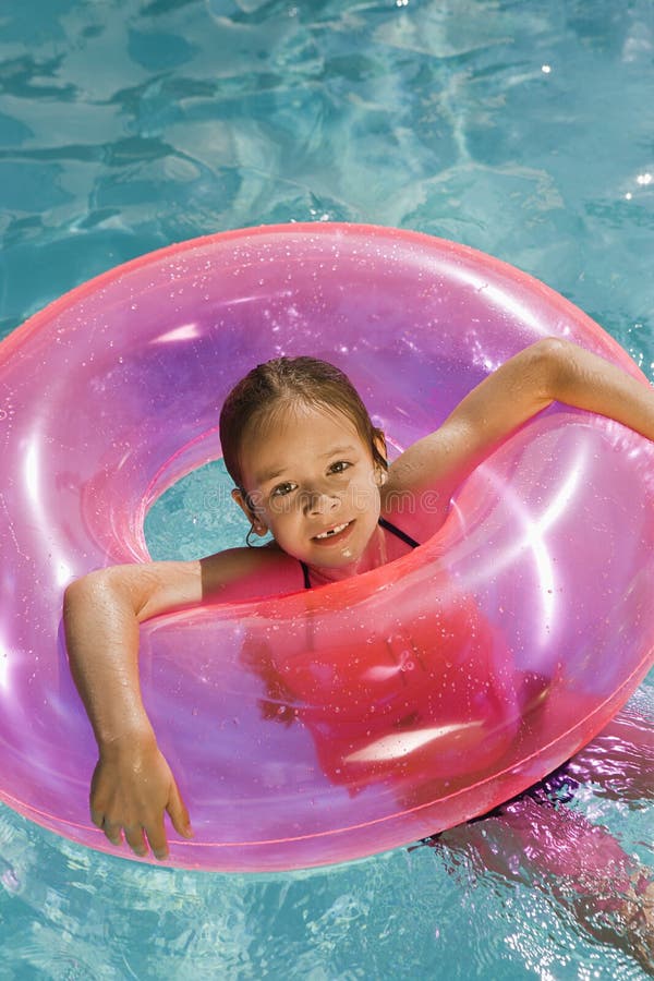 Girl Inside Pink Float Tube in Pool Stock Image - Image of holding ...