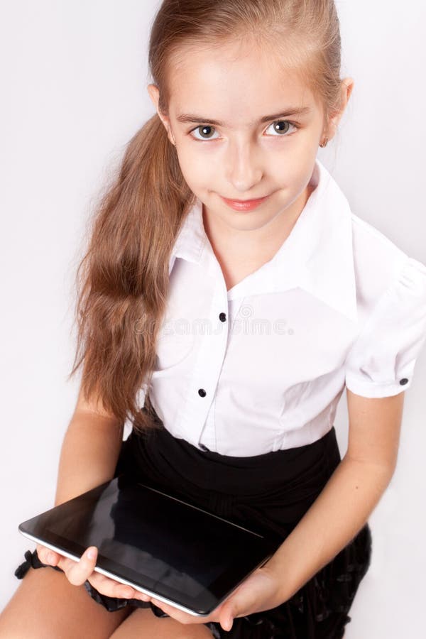 Girl with ipad like gadget stock image. Image of education - 29709407