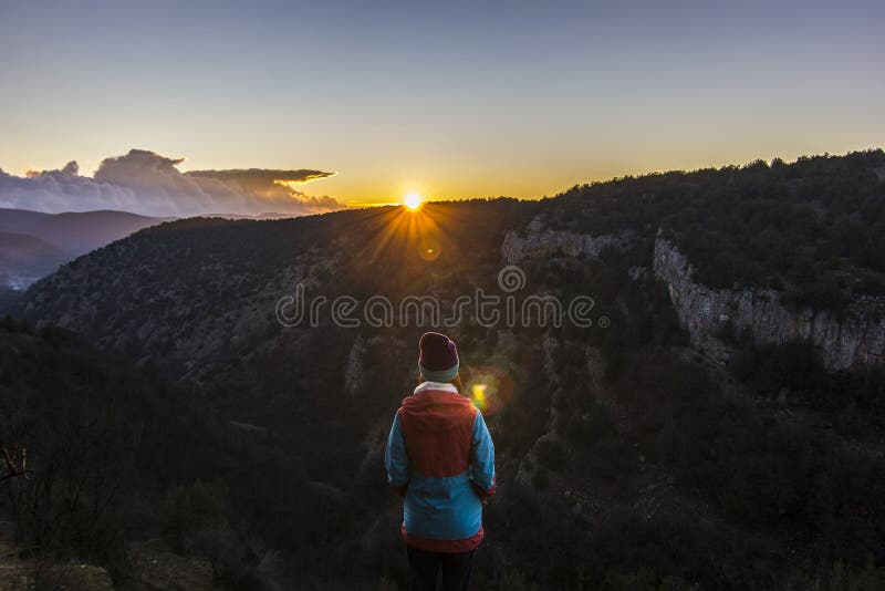 Girl Standing on a Cliff in Mountains at Sunset Stock Photo - Image of ...