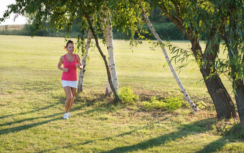 Two girls jogging stock photo. Image of freedom, grass - 32973434