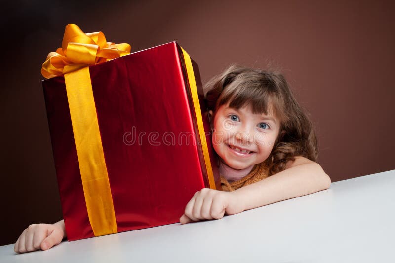 Girl Joyously Embraces the Present Stock Photo - Image of caucasian ...
