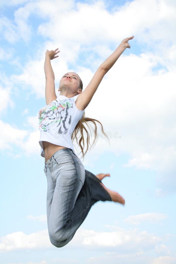 Jumping girl stock photo. Image of clouds, happiness, jumping - 1258314