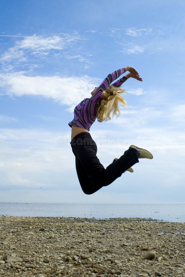 Girl jump above Baltic sea stock photo. Image of glad, casual - 807508
