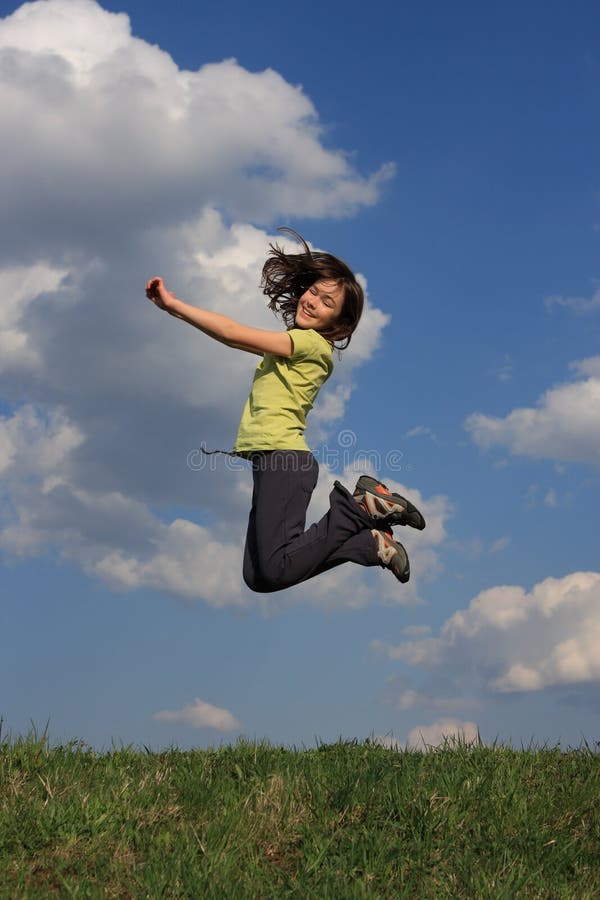 Girl jumping stock photo. Image of cloud, action, happy - 5024312