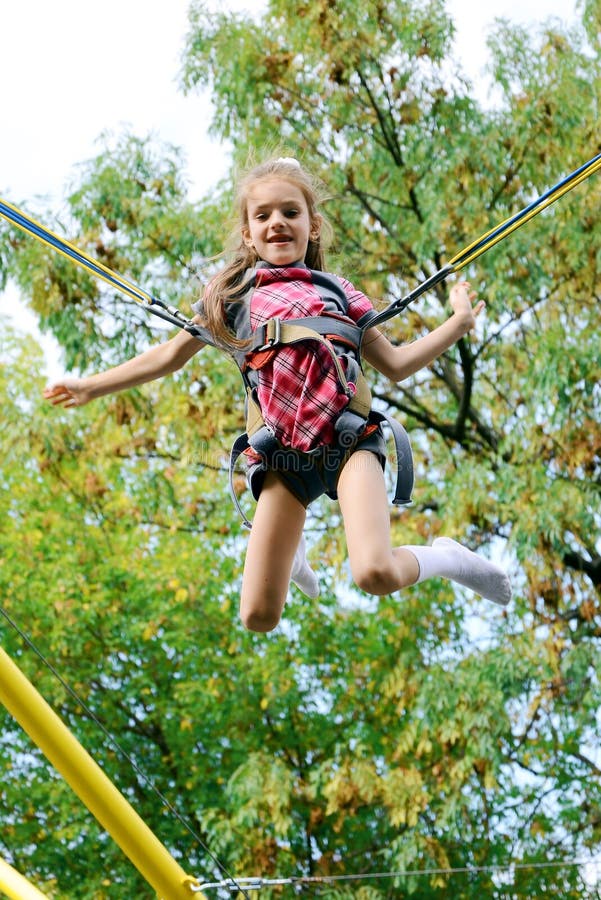 Girl Jumping on Elastic Bands Stock Image - Image of elastic ...