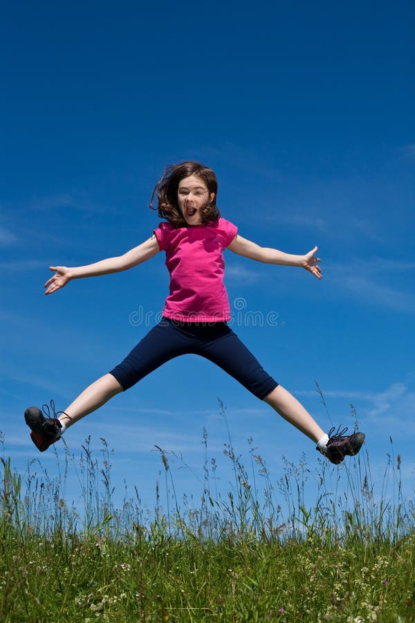 Girl jumping outdoor stock photo. Image of joyful, happiness - 9829876