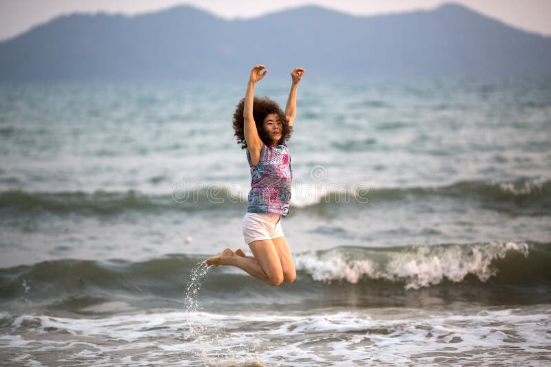 Girl Jumping on the Sea Beach. Happy. Stock Photo - Image of happy ...