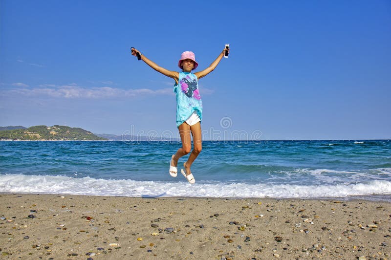Girl Jumping on the Sunny Beach Stock Photo - Image of sandy, ocean ...