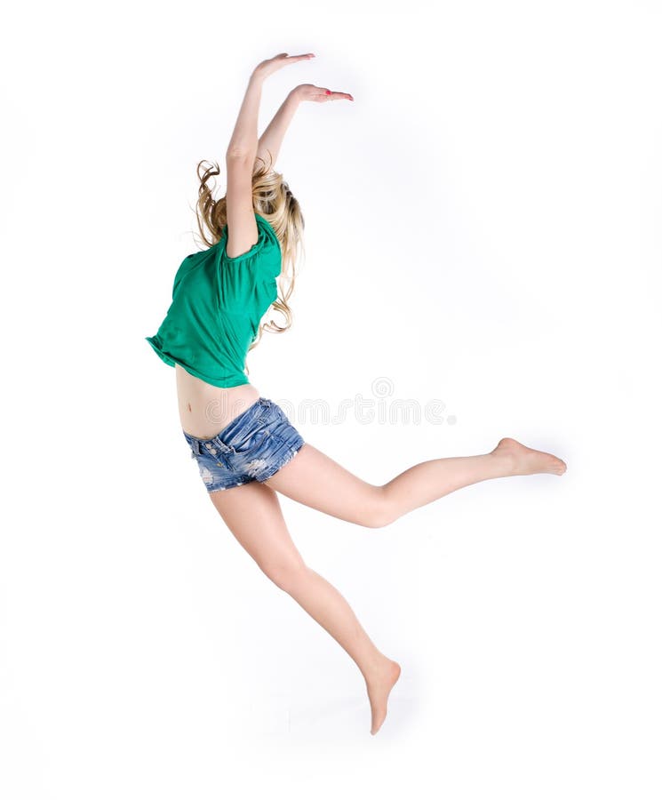 Teenage Girl Having Fun Jumping in Air on Orange Background Stock Photo ...