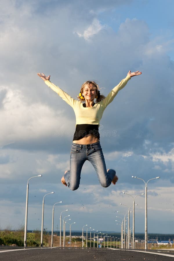 The girl jumps up stock image. Image of health, beauty - 21403251