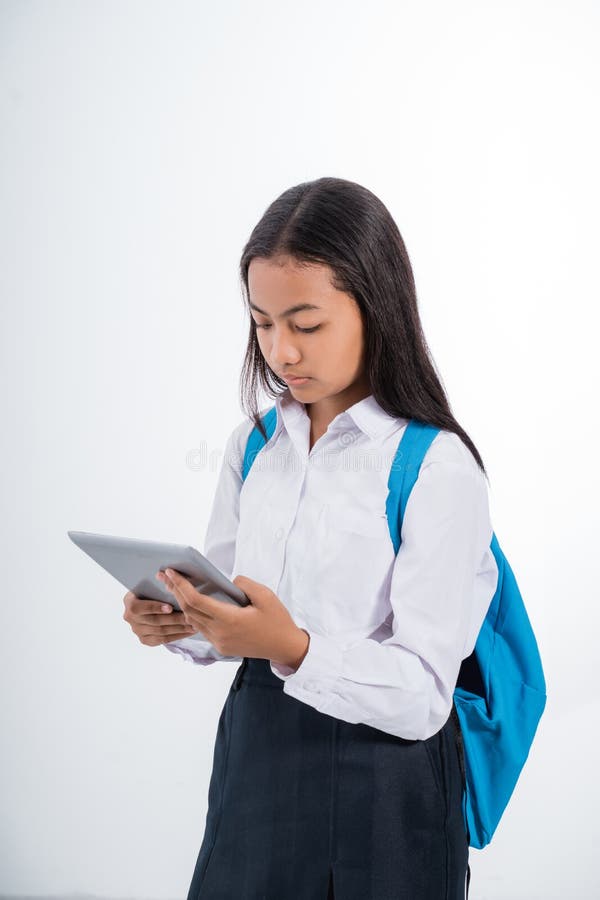 Female Junior High School Student Wearing Uniform Holding Tablet Stock ...