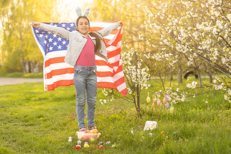 Girl Kid in Rabbit Bunny Ears on Head with Colored Eggs and American ...
