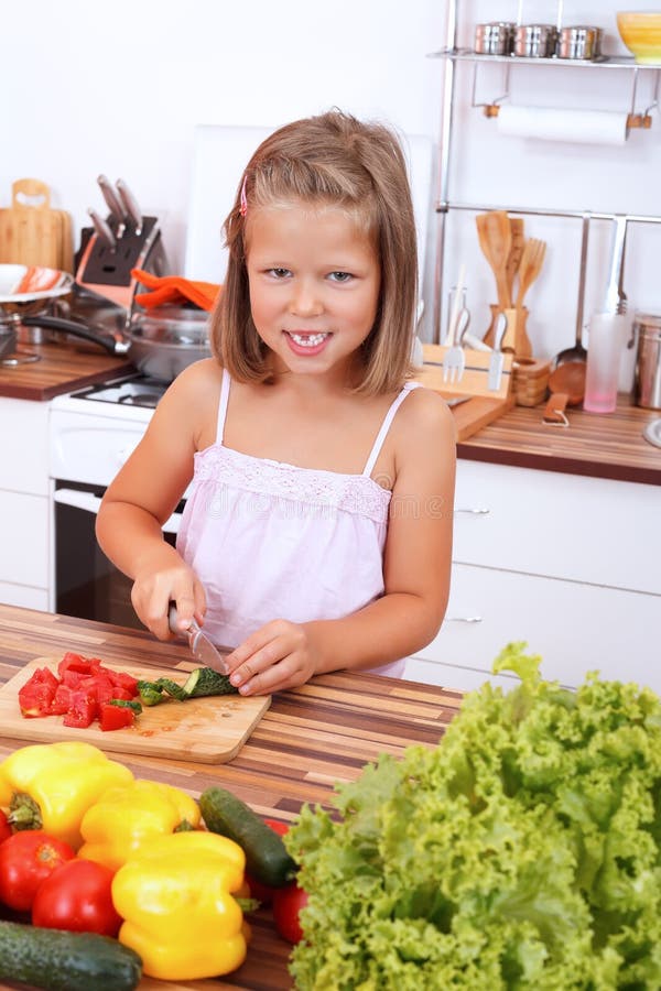 Girl in the kitchen stock image. Image of cucumber, home - 21394451