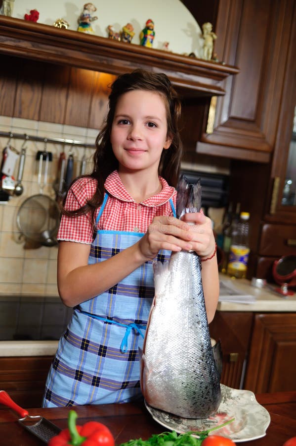 Girl in the Kitchen with Fish Stock Photo - Image of happy, lifestyle ...