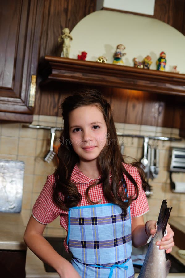 Girl in the Kitchen with Fish Stock Image - Image of female, bake ...
