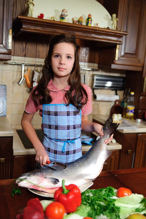 Girl in the Kitchen with Fish Stock Image - Image of cute, cook: 179213693