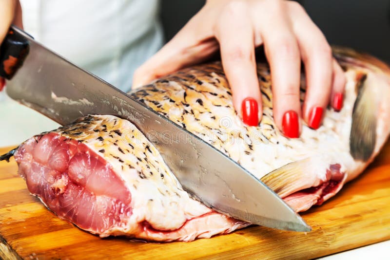 Girl with a Kitchen Knife Cut the Fish Stock Photo - Image of fresh ...