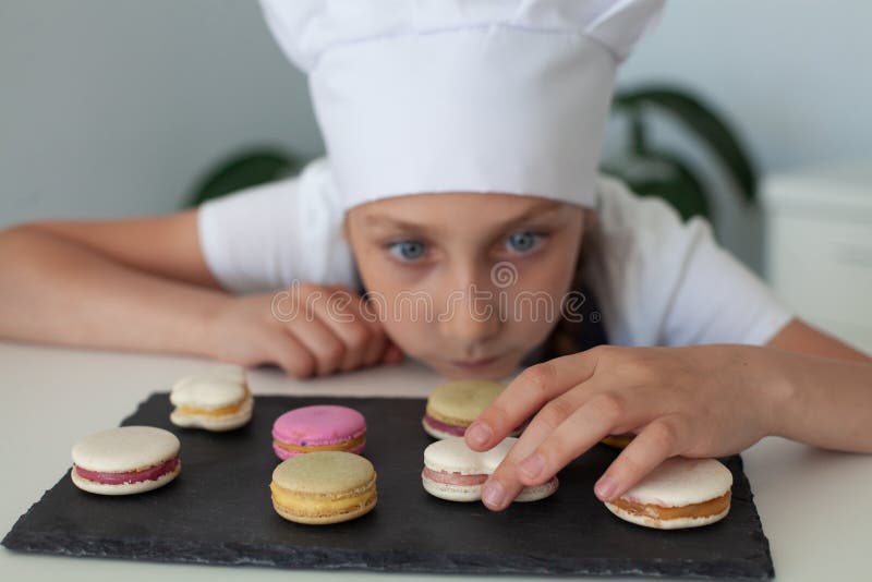 The Girl in the Kitchen with Plate Macaroons Stock Photo - Image of ...