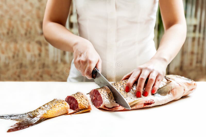 Girl with a Kitchen Knife Cut the Fish Stock Photo - Image of fresh ...