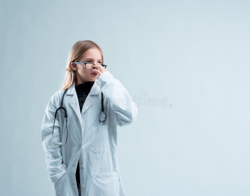 Girl in Lab Coat Points, Dreaming Big Stock Photo - Image of curiosity ...