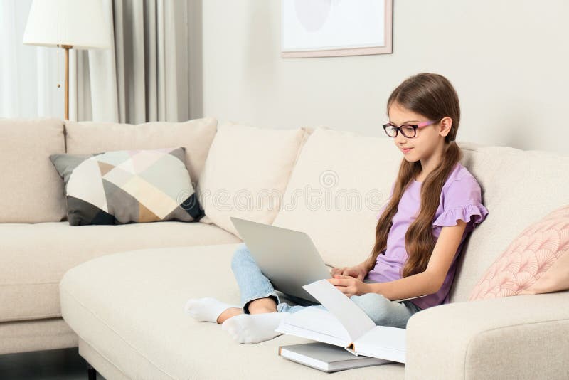 Girl with Laptop and Books on Sofa Stock Image - Image of internet ...