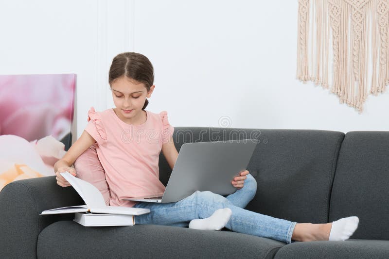 Girl with Laptop and Books on Sofa at Home Stock Image - Image of ...