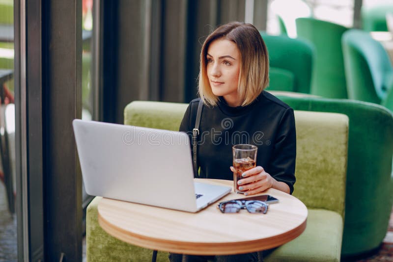 Girl laptop cafe cocktail stock photo. Image of attractive - 93822422