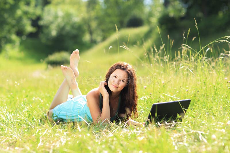 Girl with laptop outdoors stock photo. Image of lawn - 46624206